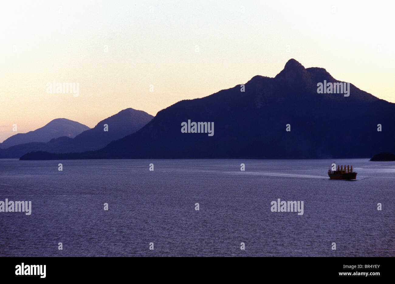 A tanker ship sailing in Howe Sound at sunset near Vancouver British ...