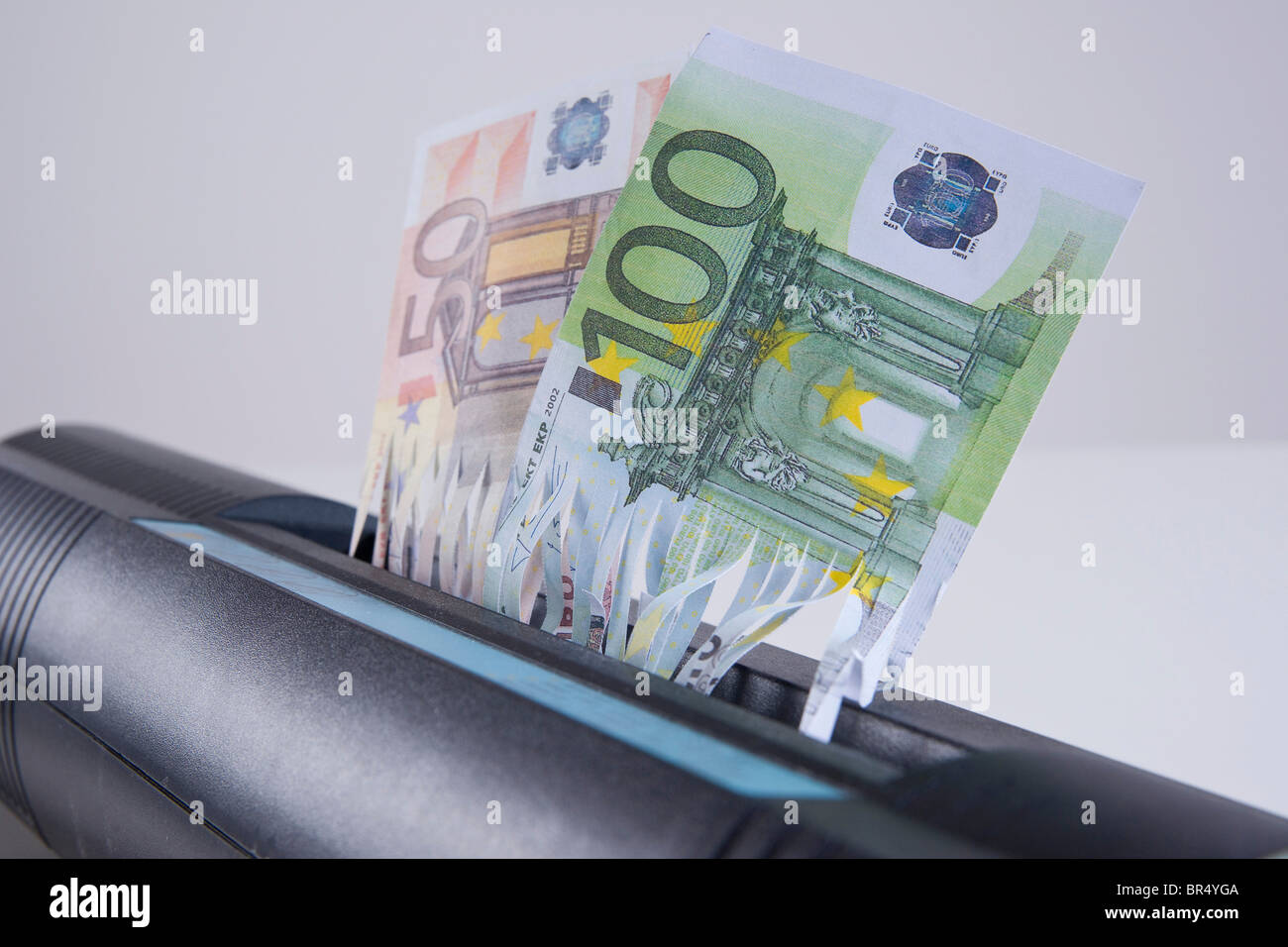 Bank notes in a shredder Stock Photo - Alamy
