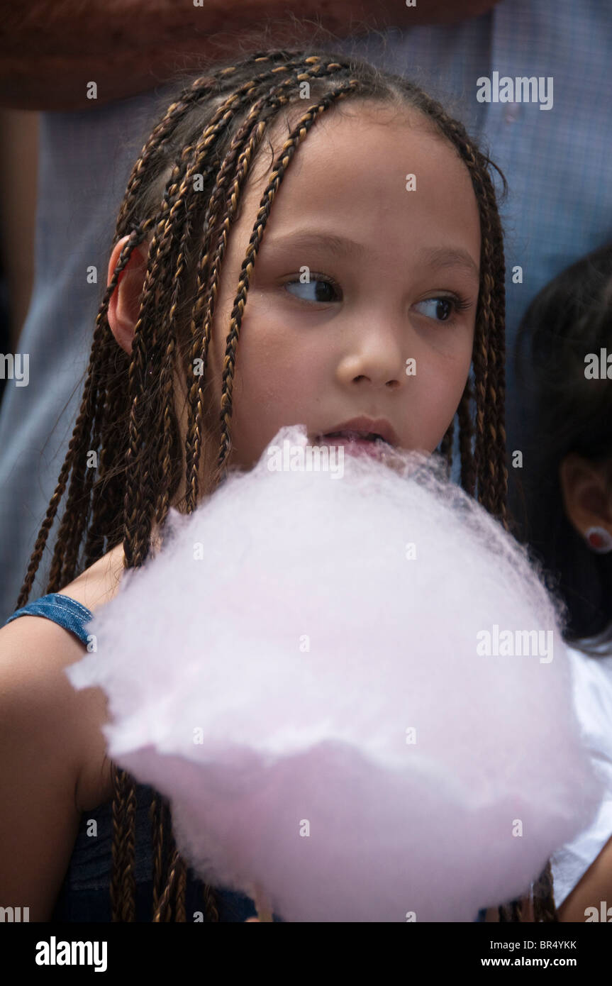 eating cotton candy at the Silom Street Fair in Bangkok Thailand Stock ...
