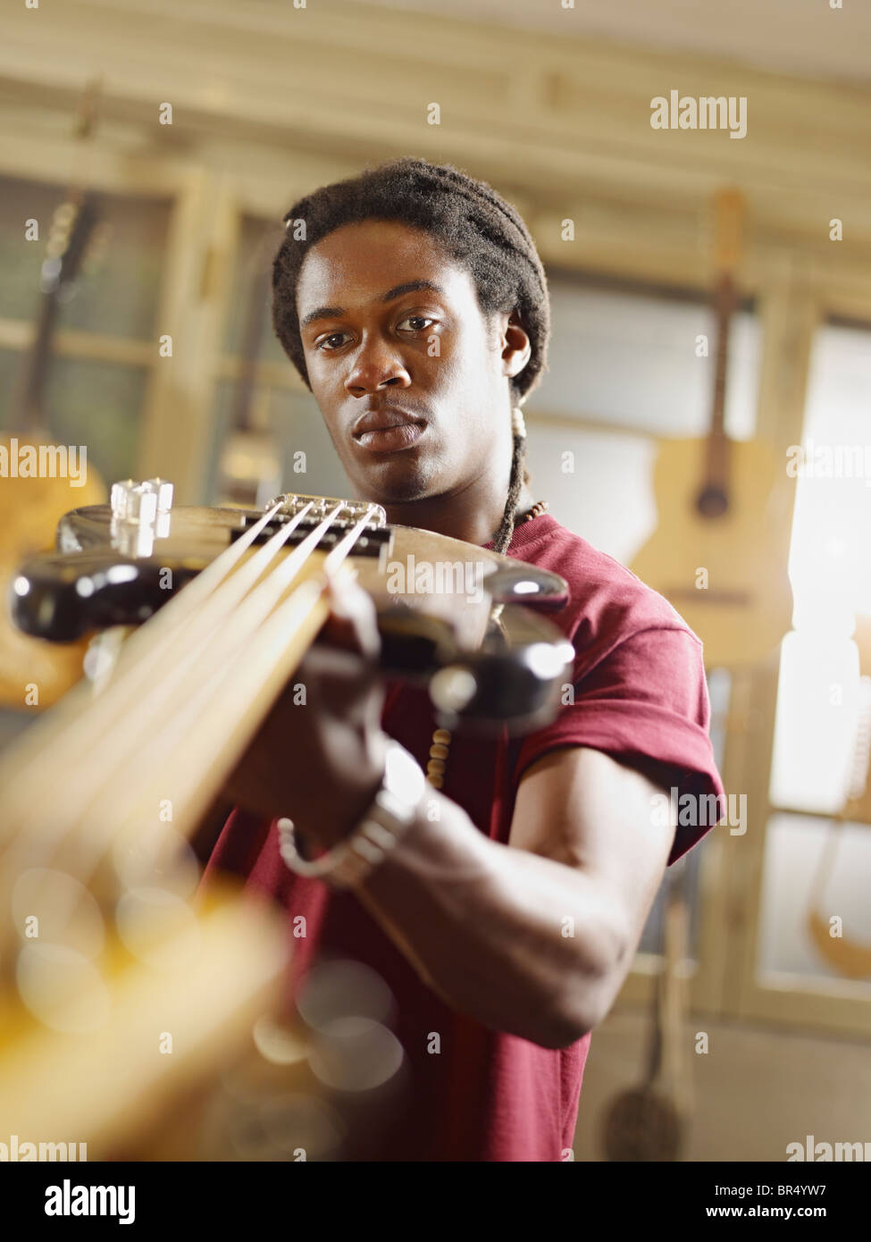 African man holding electric guitar hi-res stock photography and images ...