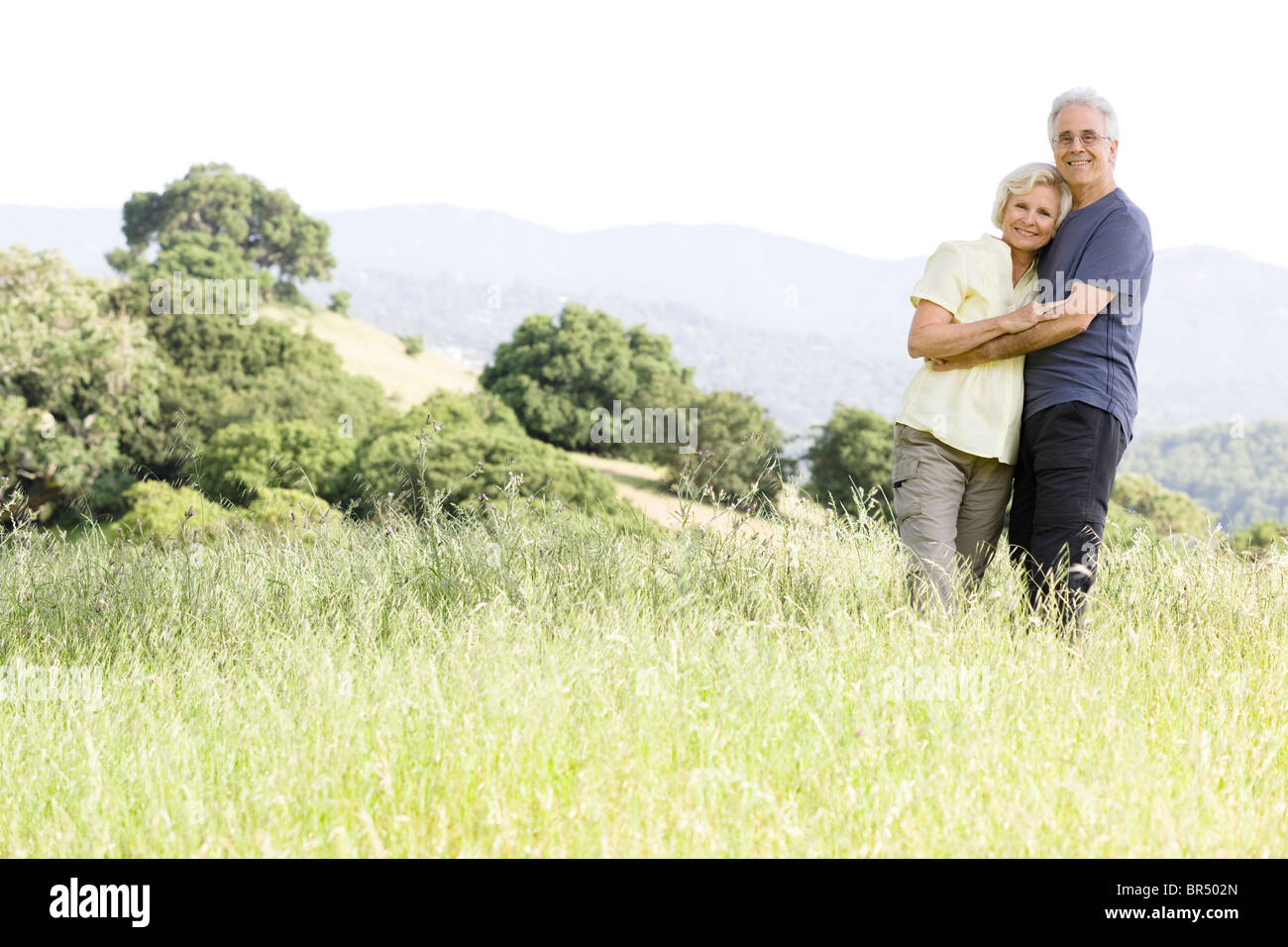 Hugging couple looking field landscape hi-res stock photography and ...