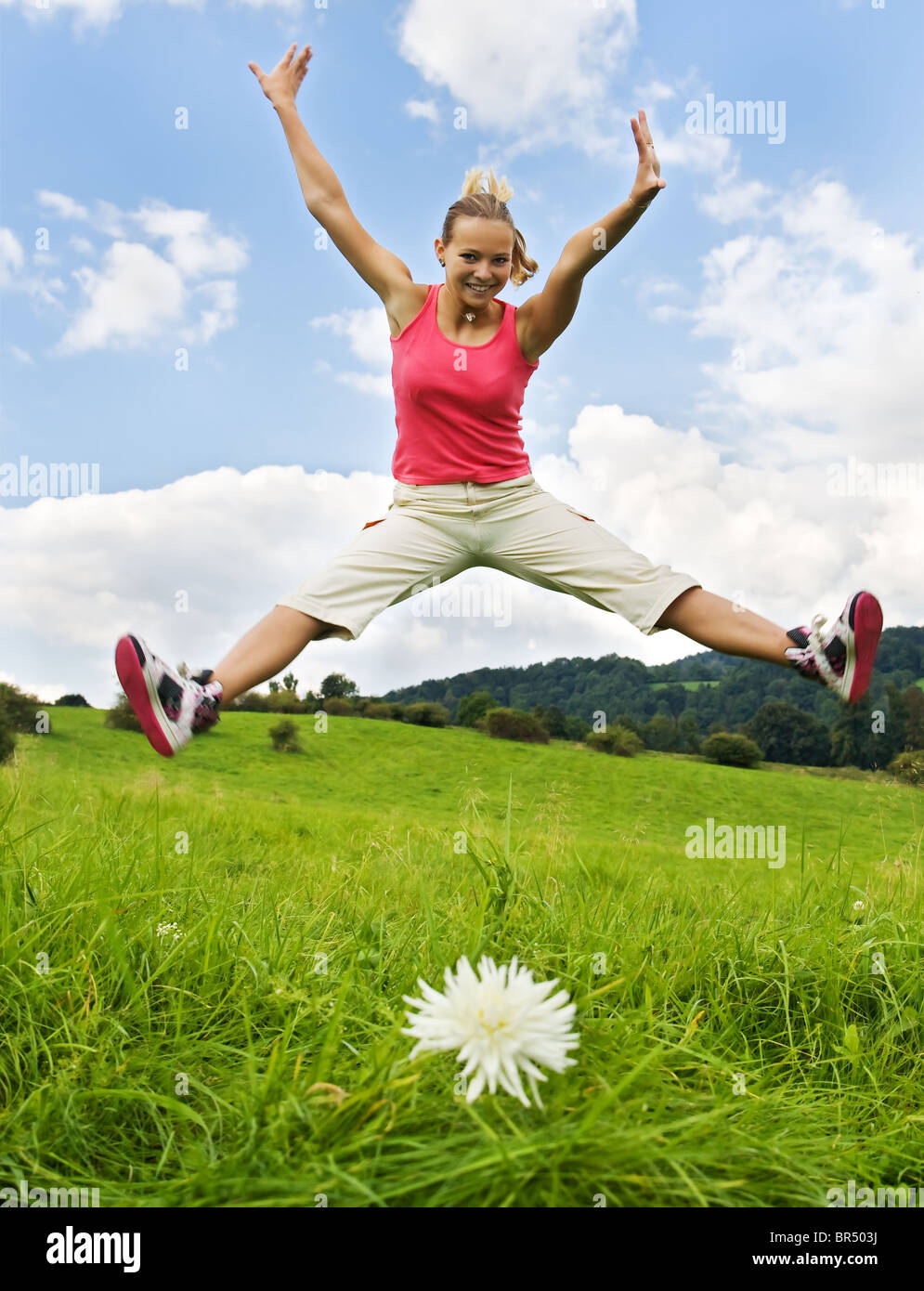 girl jump on meadow Stock Photo - Alamy