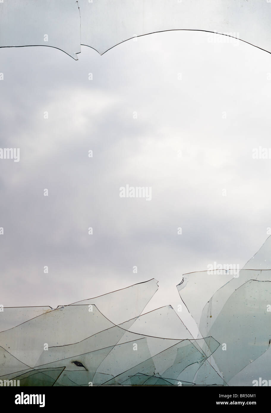 A view through a broken window at the cloudy sky Stock Photo - Alamy