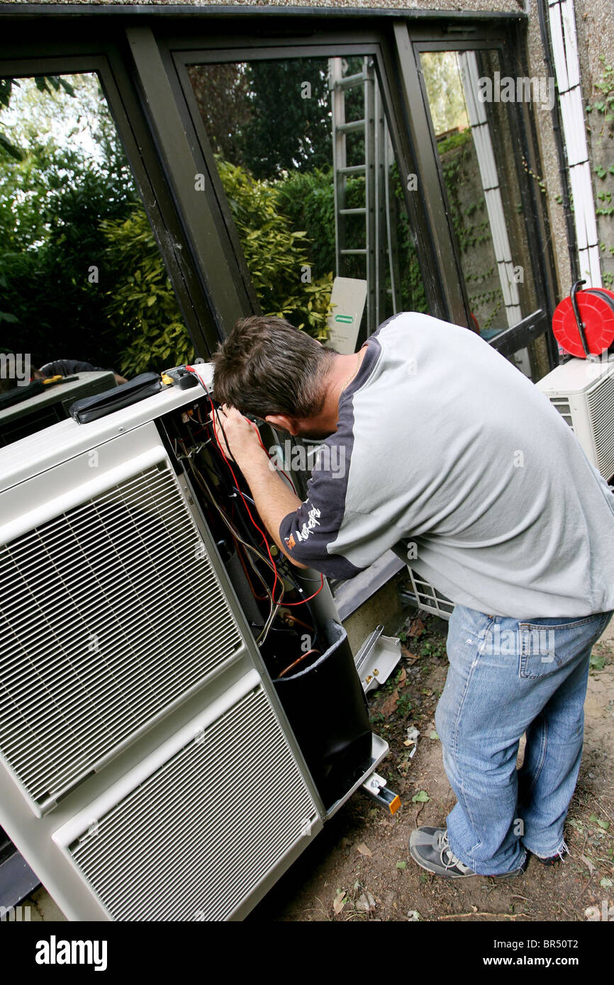 Installation of an air-conditioning system in a house Stock Photo - Alamy