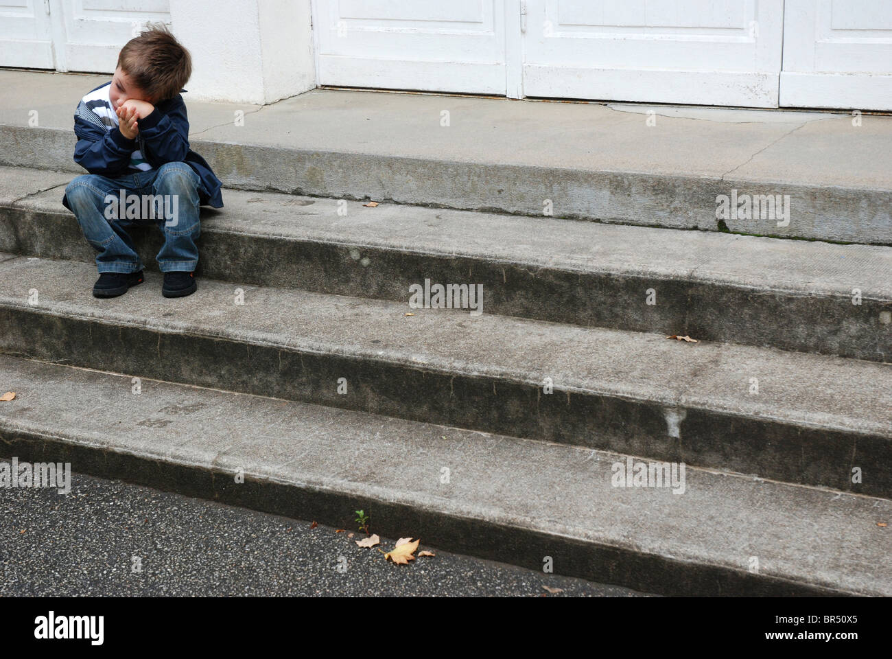 Sad child at school Stock Photo - Alamy
