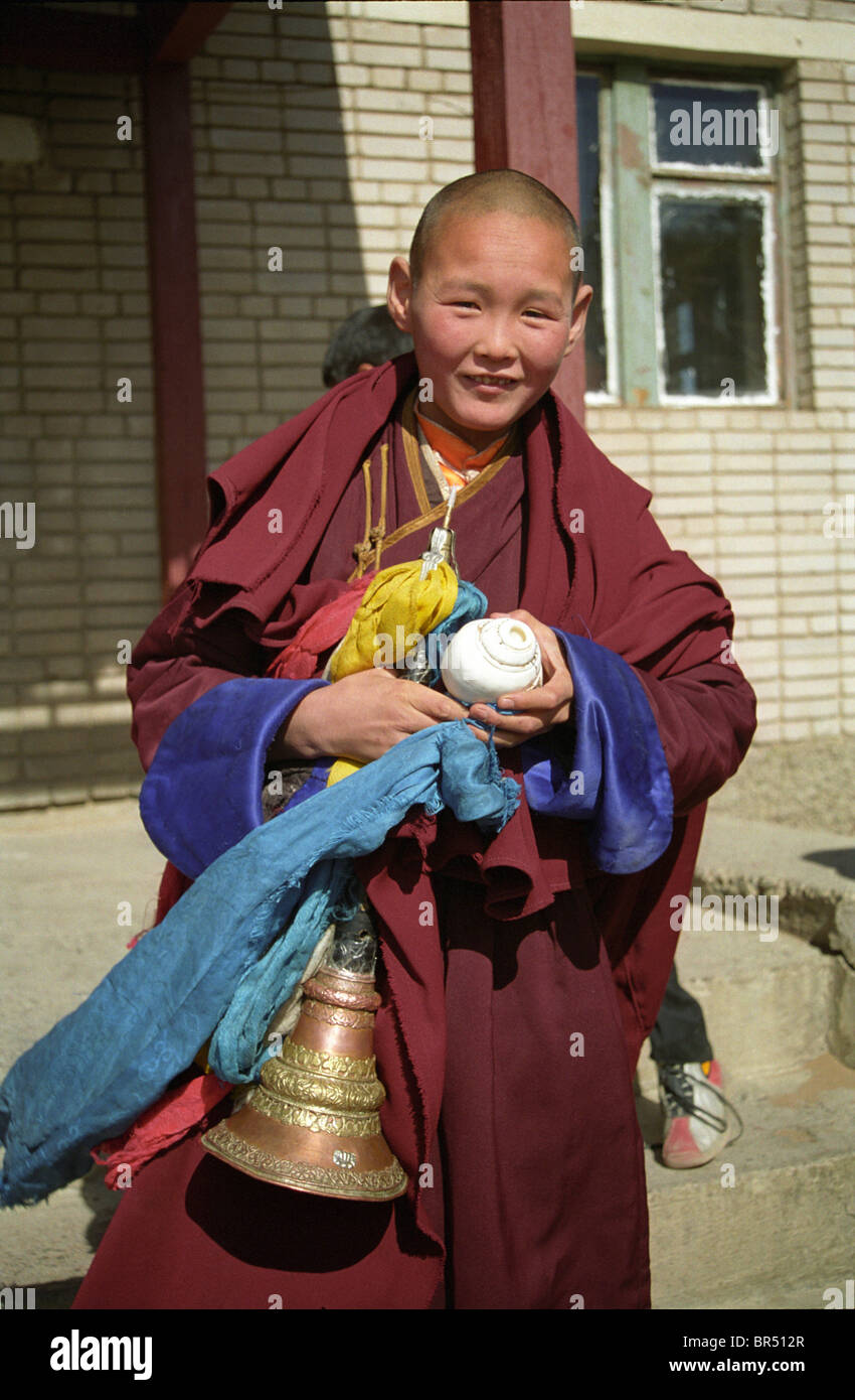 Monk with a conch and a bell Arvairkheer Mongolia Stock Photo - Alamy