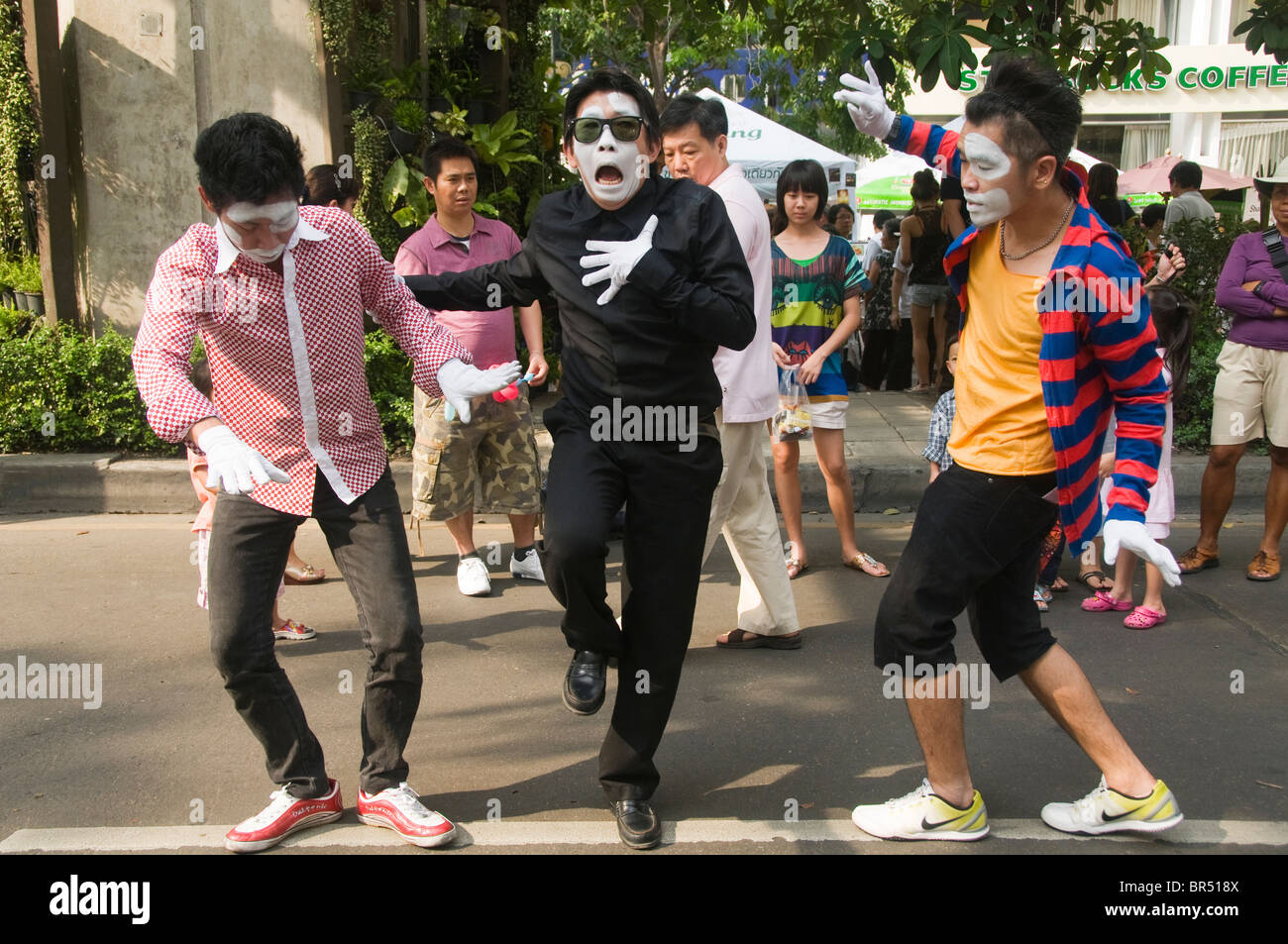 street mimes performing at the Silom Street Fair in Bangkok Thailand ...
