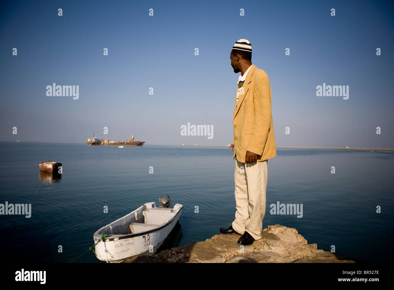 Fisherman at the port in Berbera looks out over the Red Sea Stock Photo ...