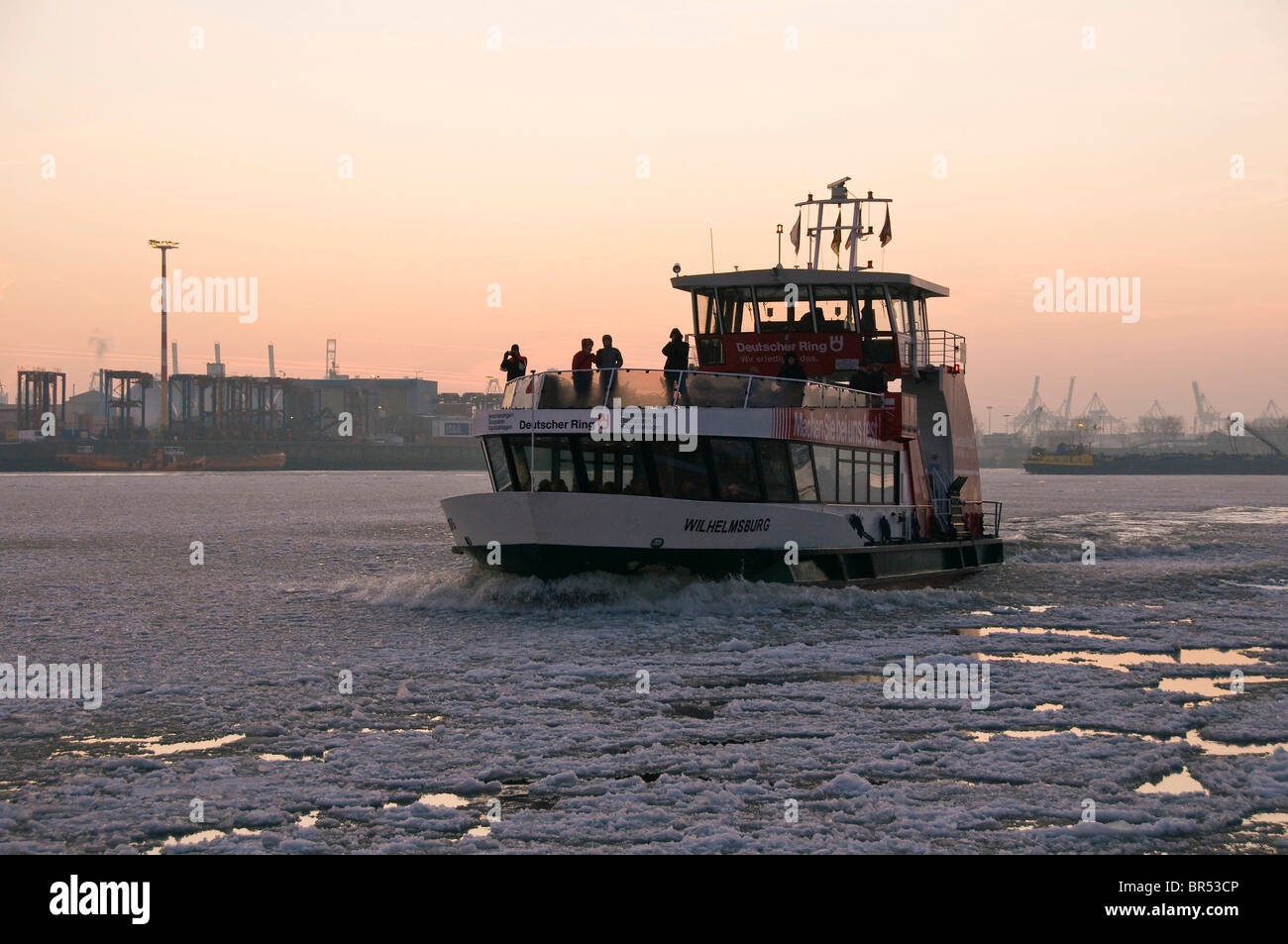 A HADAG harbour ferry navigating through the ice at the Port of Hamburg ...