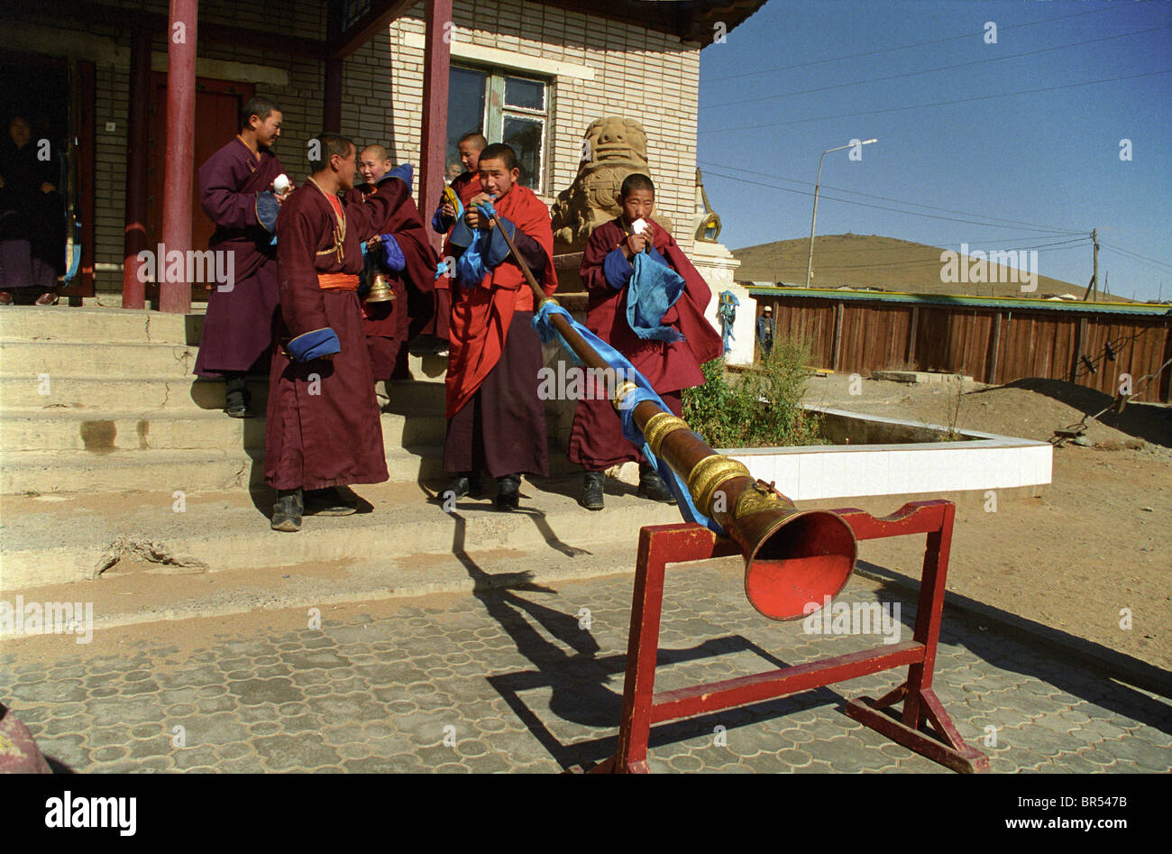 Monks playing music in front of monastery Arvairkheer Mongolia Stock ...