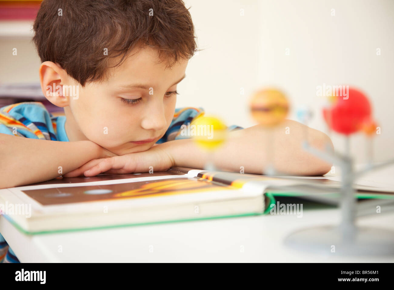 Boy Reading Book Stock Photo - Alamy