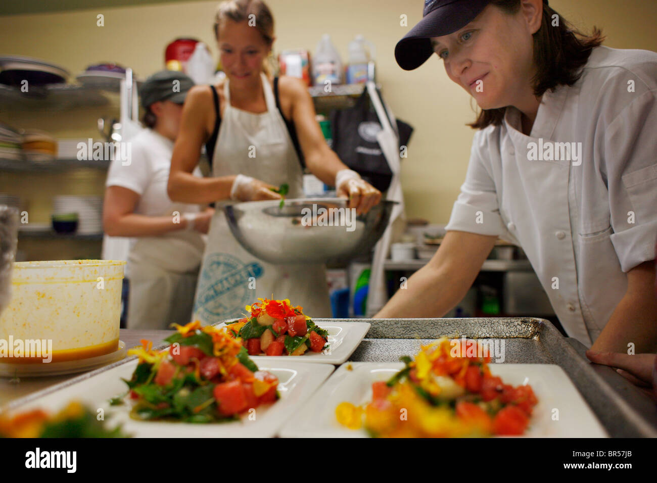 Chefs prepping salad in the kitchen Stock Photo - Alamy