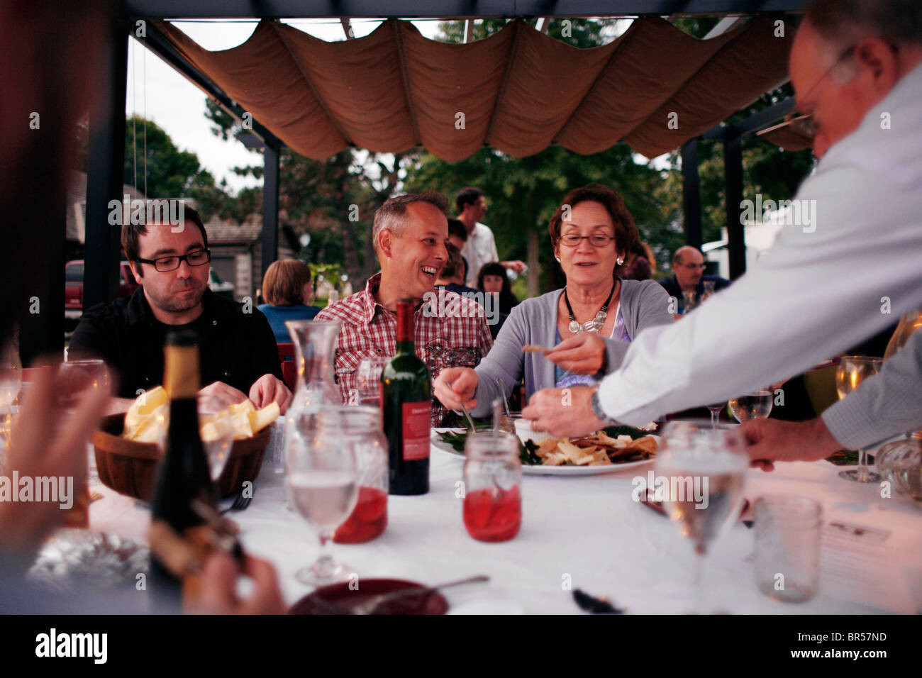 A group eating outdoors on a rural farm Stock Photo - Alamy