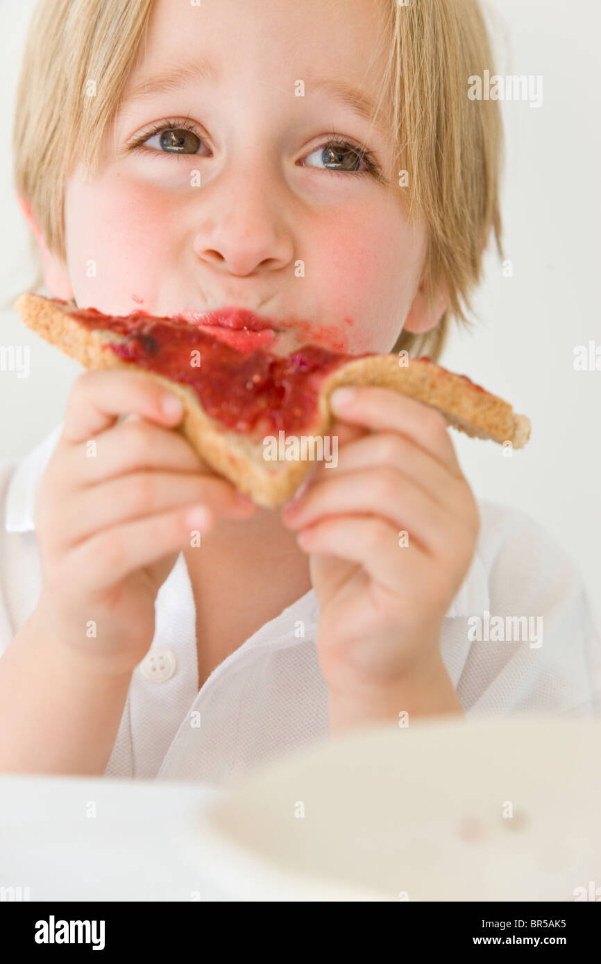 Kid eating toast close up hi-res stock photography and images - Alamy