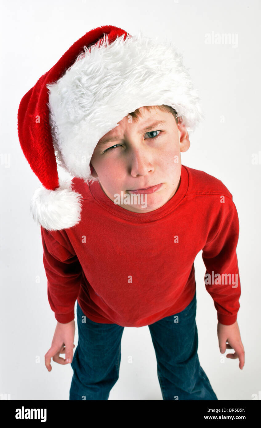 Boy in Christmas hat Stock Photo - Alamy