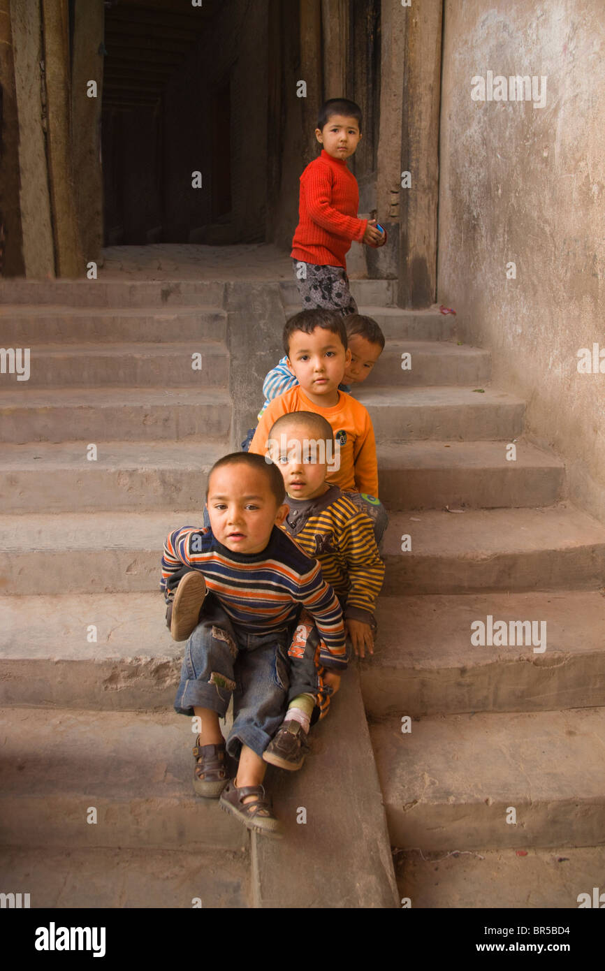 Children playing on the stairs, Kashgar, Xinjiang, China Stock Photo ...