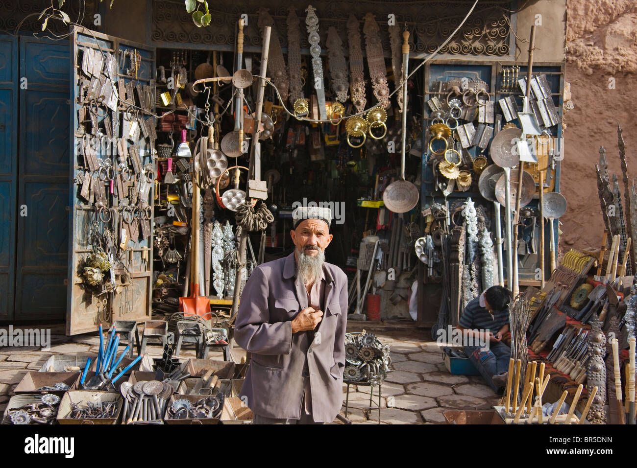 Man selling pots, Kashgar, Xinjiang, China Stock Photo - Alamy