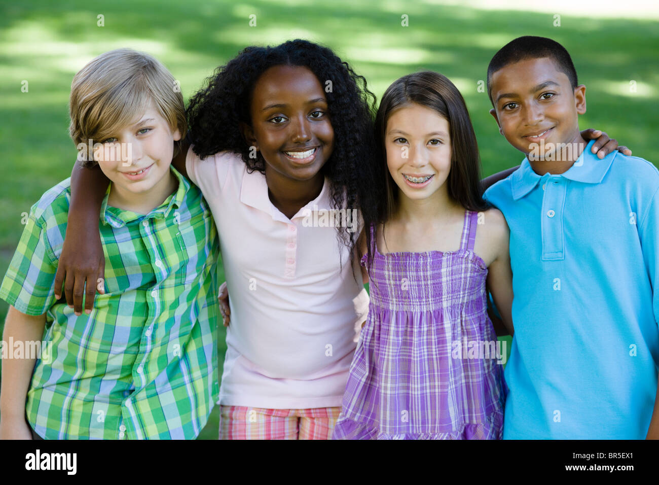 Happy children hugging Stock Photo - Alamy