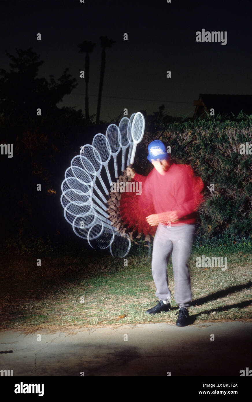 Multi-flash photo shows tennis stroke in sequence of motion racket ...