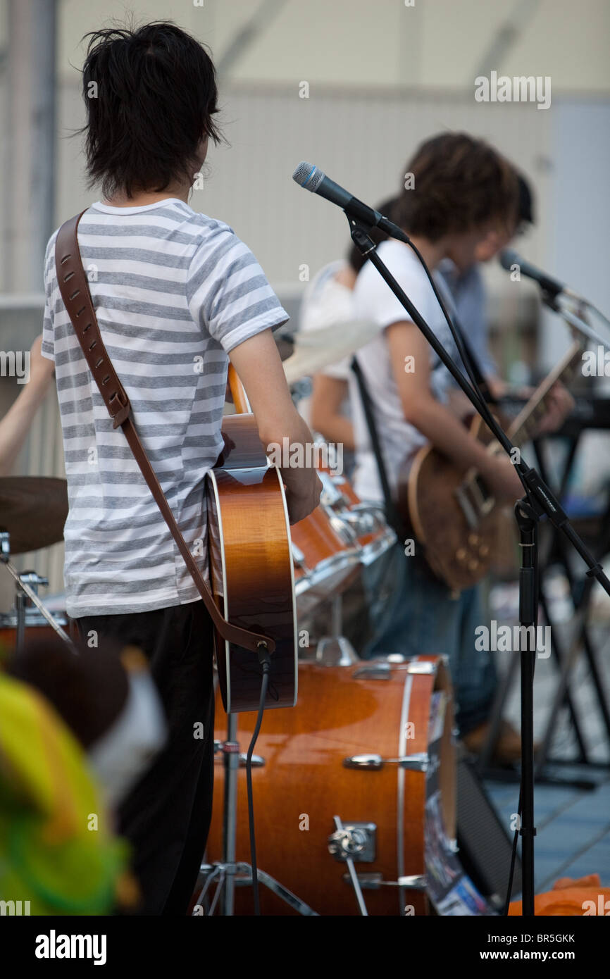 Music band group playing in the street, in Osaka, Japan Stock Photo - Alamy
