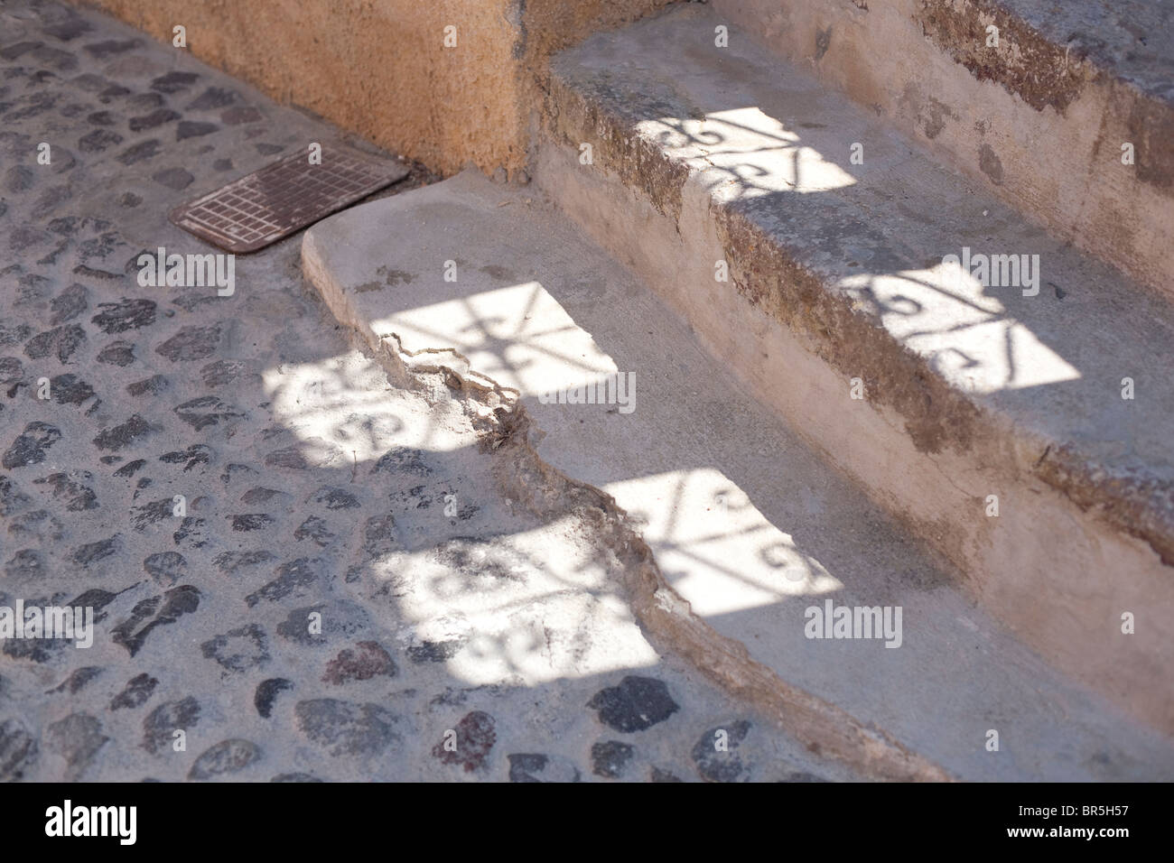 Abstract shadows on stone street Stock Photo - Alamy