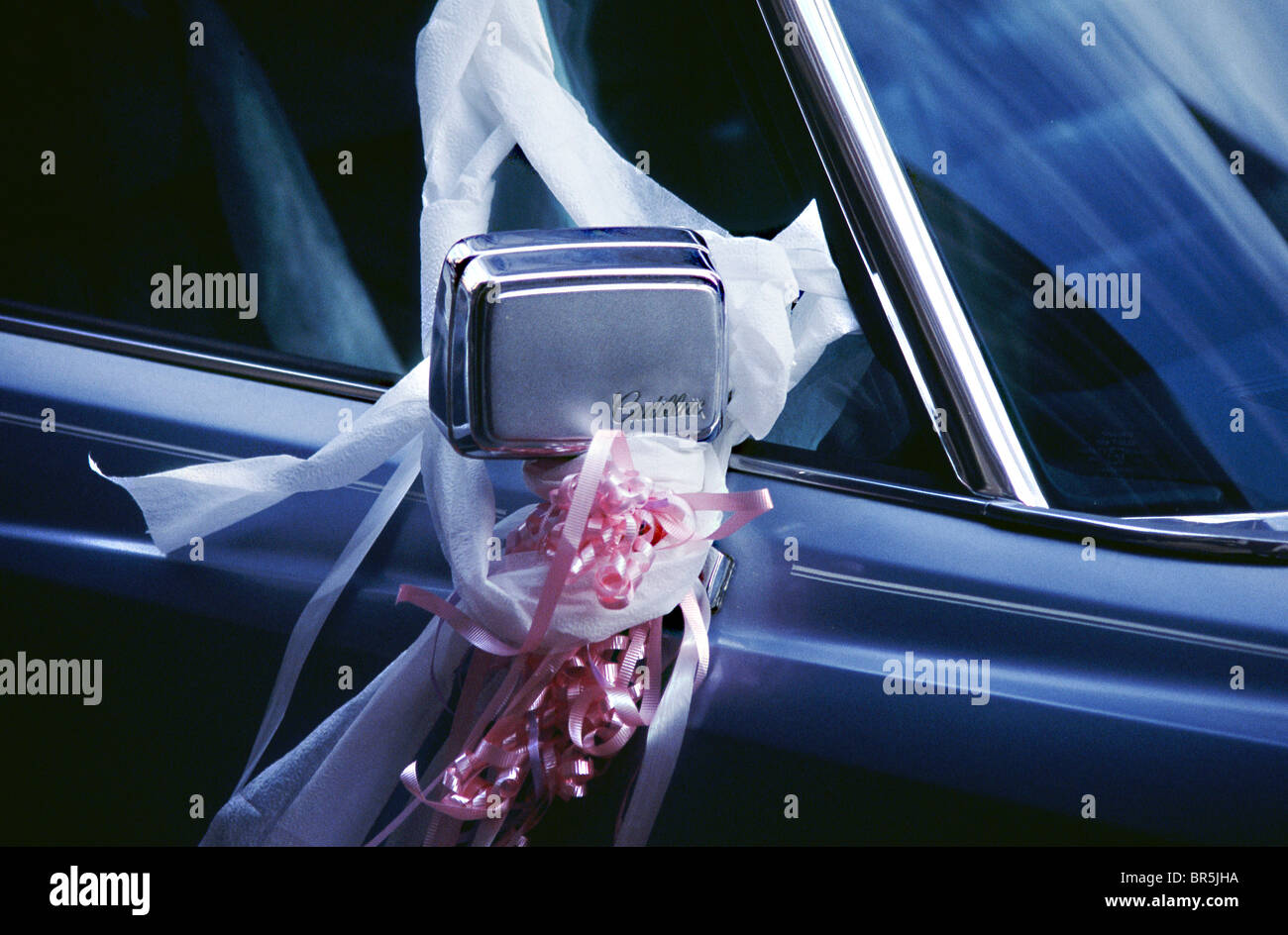 Cadillac rear view mirror with wedding decoration Stock Photo - Alamy