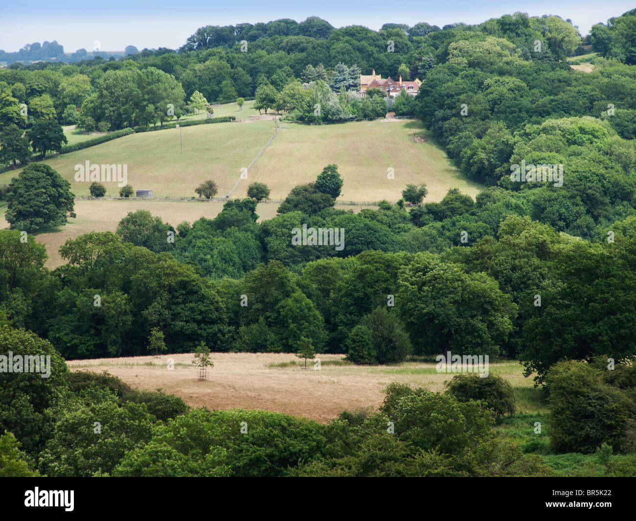 cotswolds landscape view over farmland fields and trees Stock Photo - Alamy