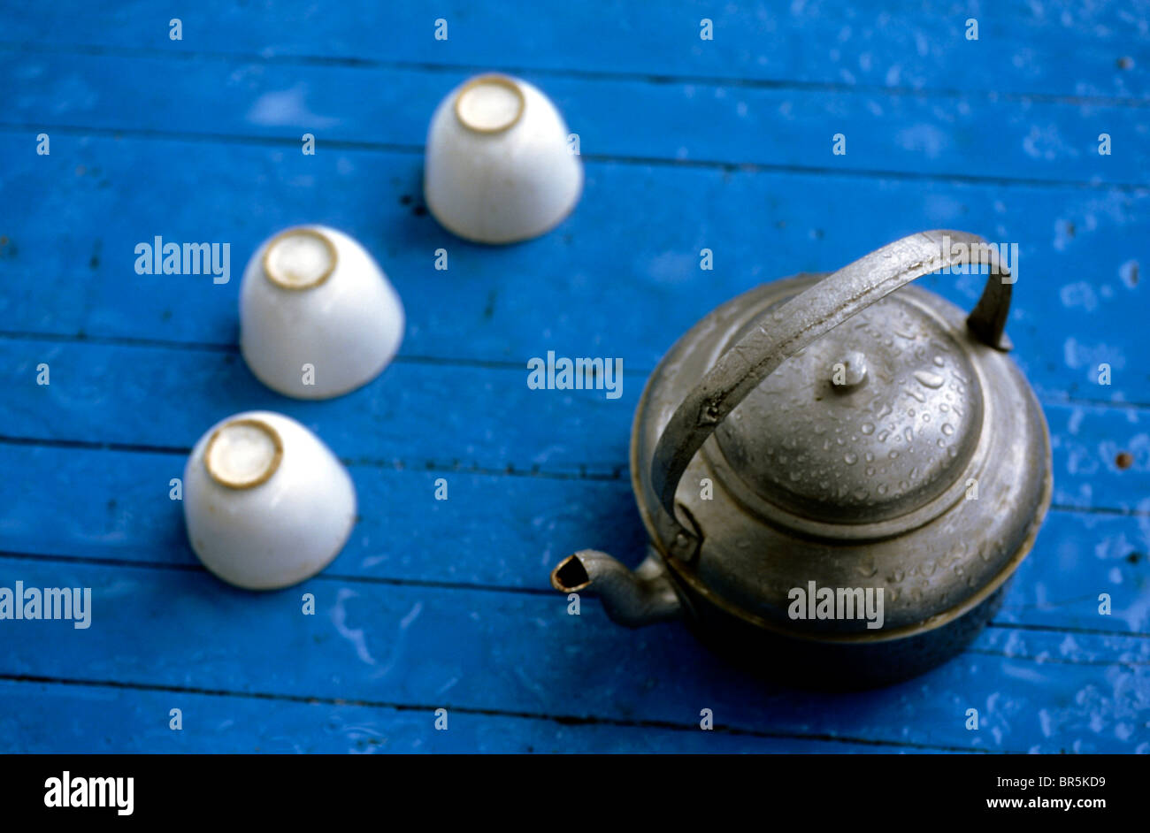 Teapot and three cups in monsoon rain, Burma, Myanmar, Asia Stock Photo ...