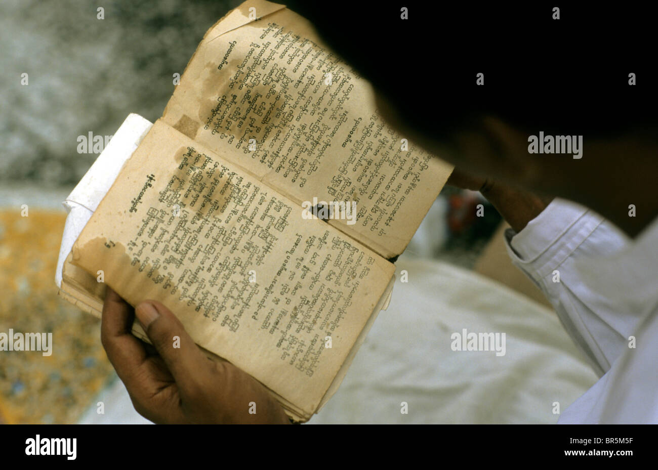 Man reading Buddhist writings, Burma, Myanmar, Asia Stock Photo - Alamy