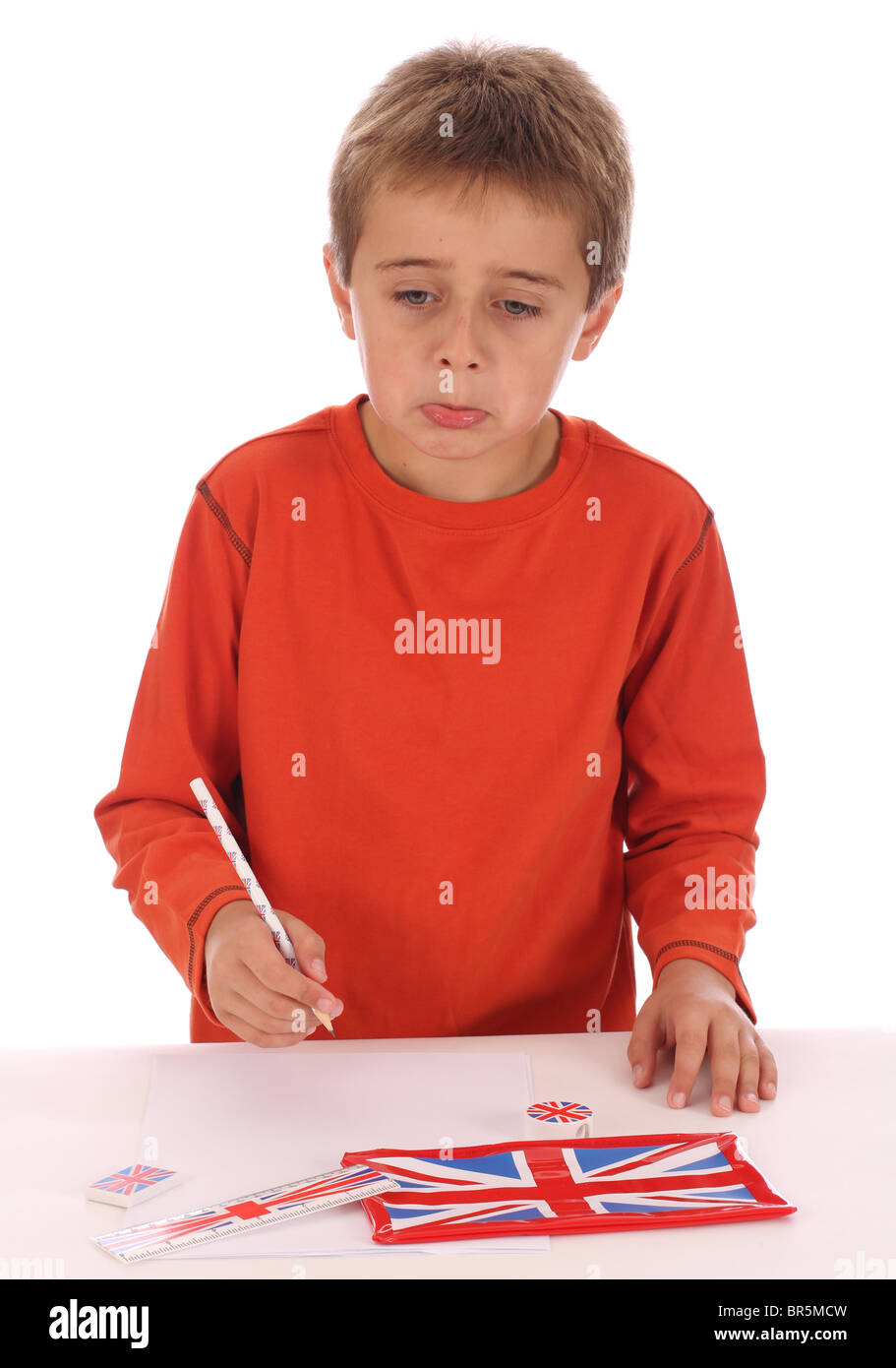 young boy with a union jack pencil case and pen Stock Photo - Alamy