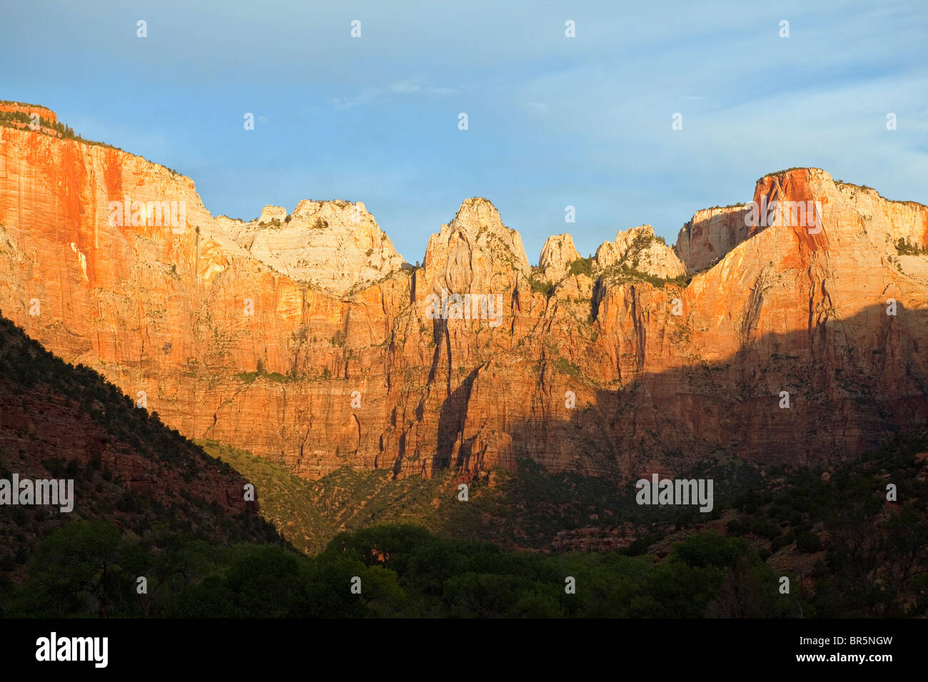 First rays of morning light on the cliffs at Zion National Park in ...