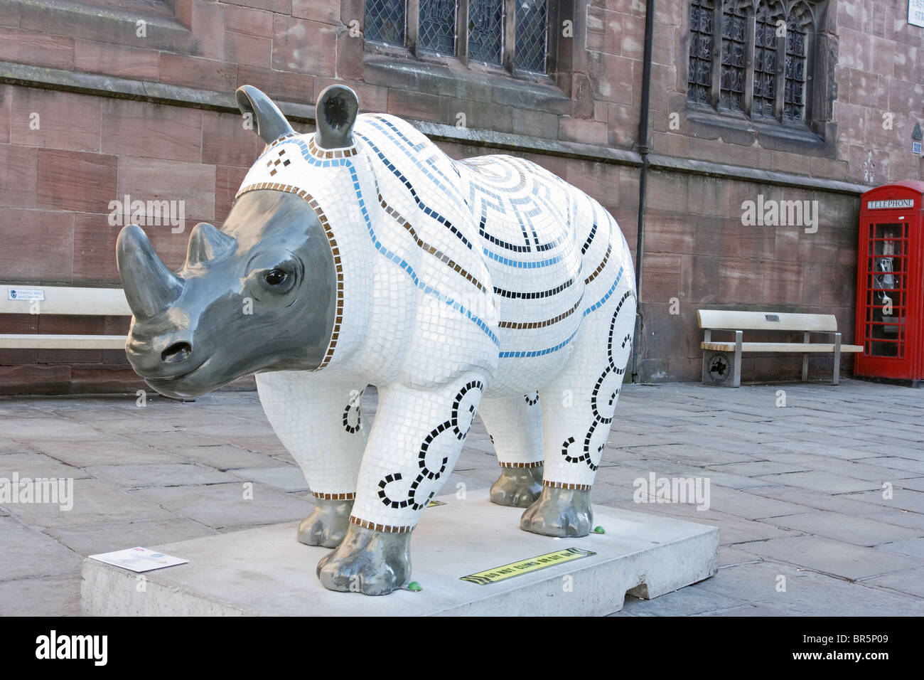 A charity sculpture of a rhino on a city street in Chester Stock Photo ...