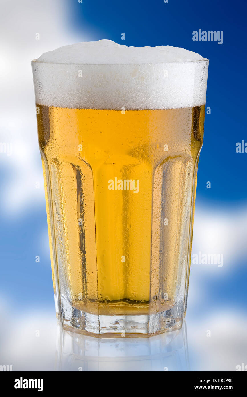 continental glass of beer against a sky background Stock Photo - Alamy