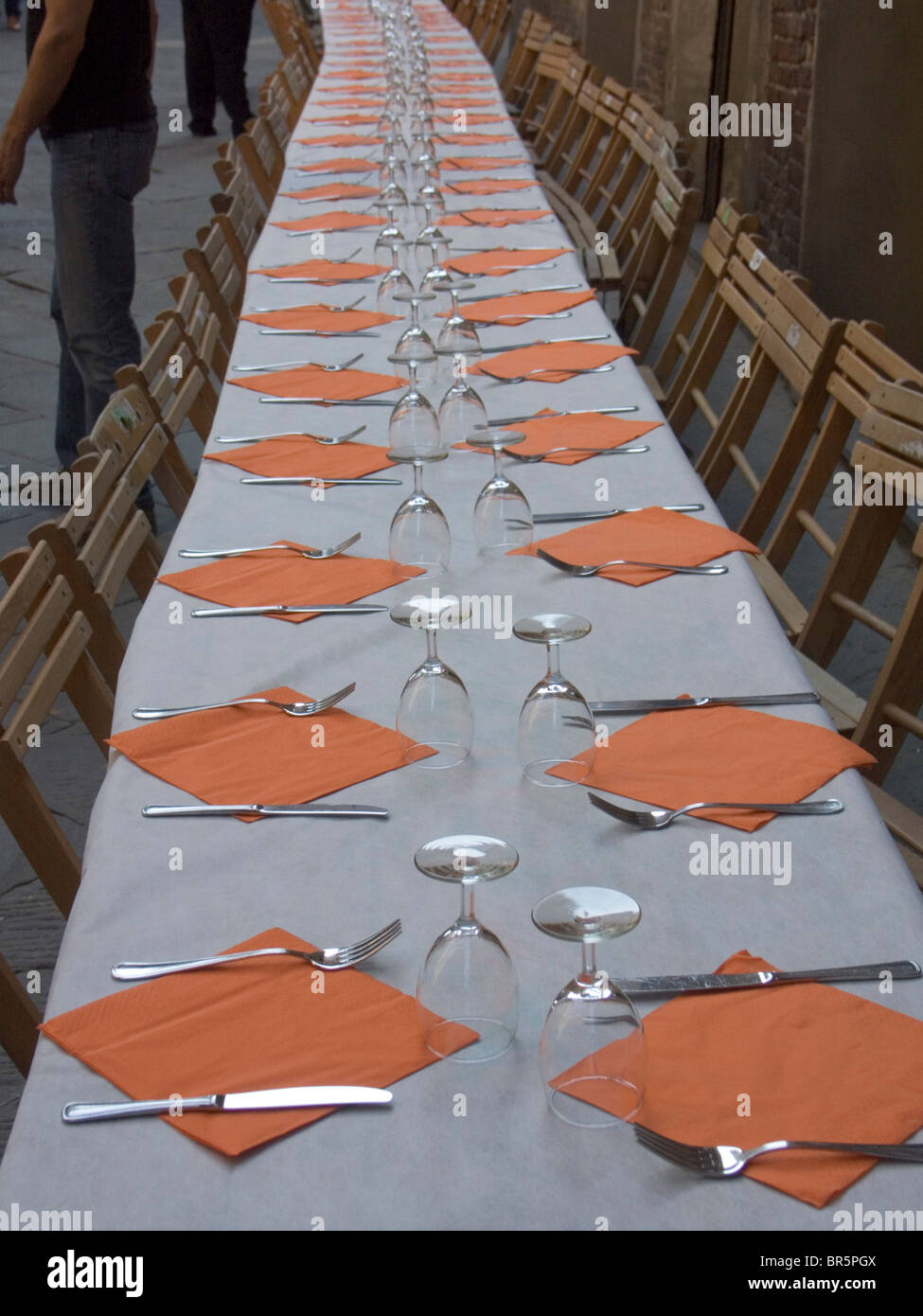 Newly set tables for post-race dinner in one of the neighborhoods that ...