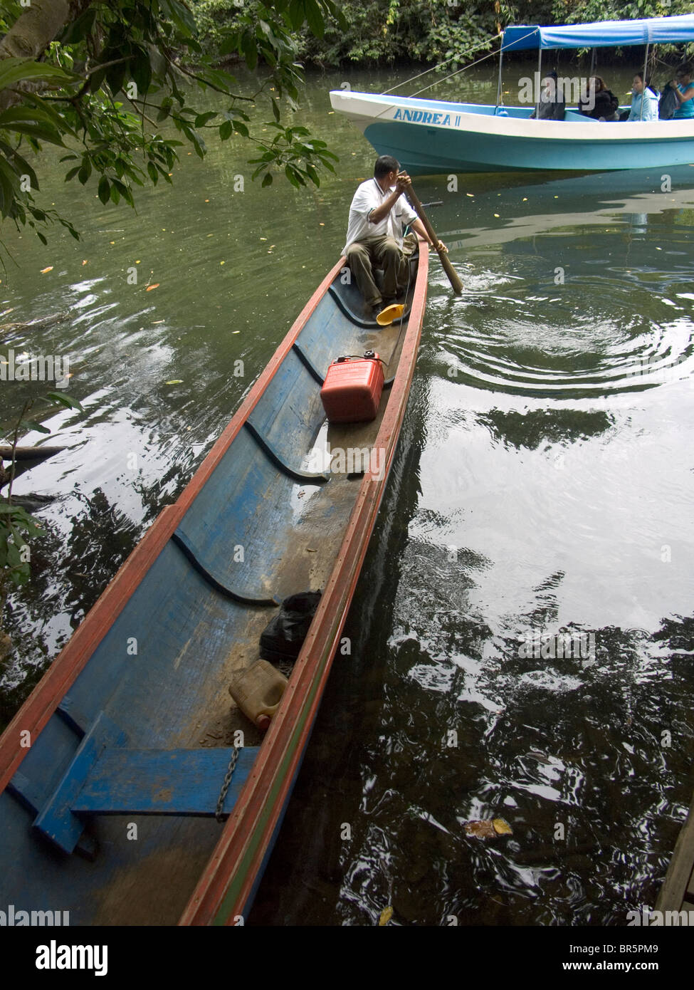 Tourist boats parked on a river dock on the river Rio Dulce Stock Photo ...