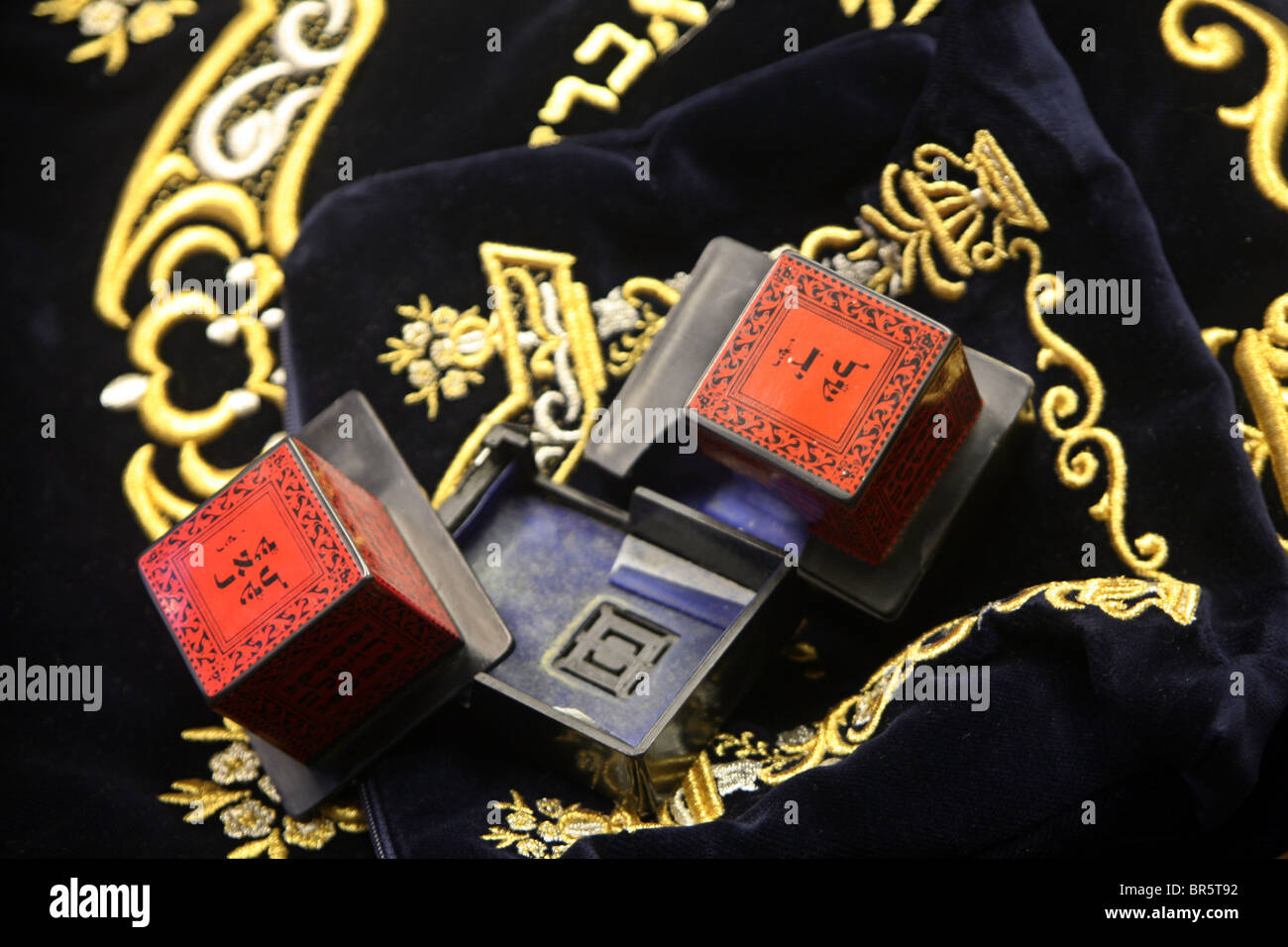 Two Tefillin cases on top of a velvet case used to protect the Tallit ...