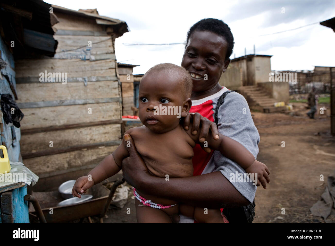 A mother and baby boy on the outskirts of Kalerwe market, Kampala ...