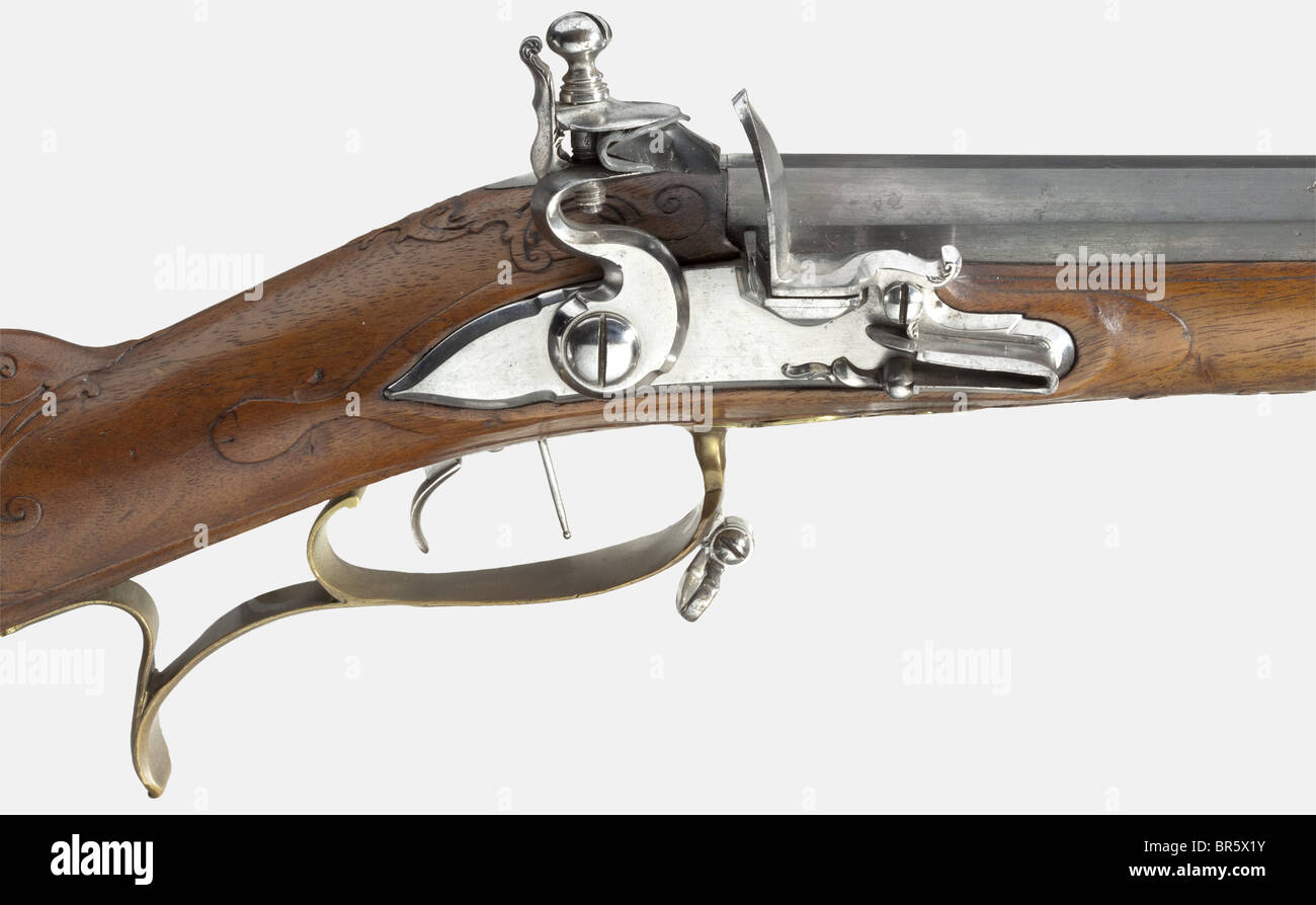 A flintlock rifle, Southern German, circa 1780. Blued octagonal barrel ...