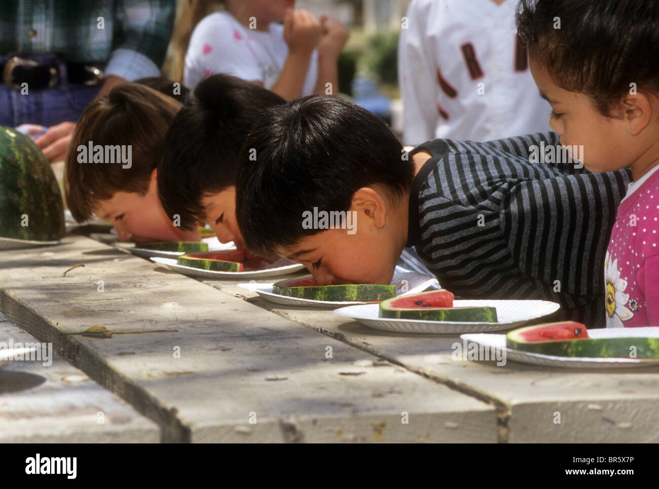 Boy watermelon eating contest picnic fair fun eat sloppy compete race ...