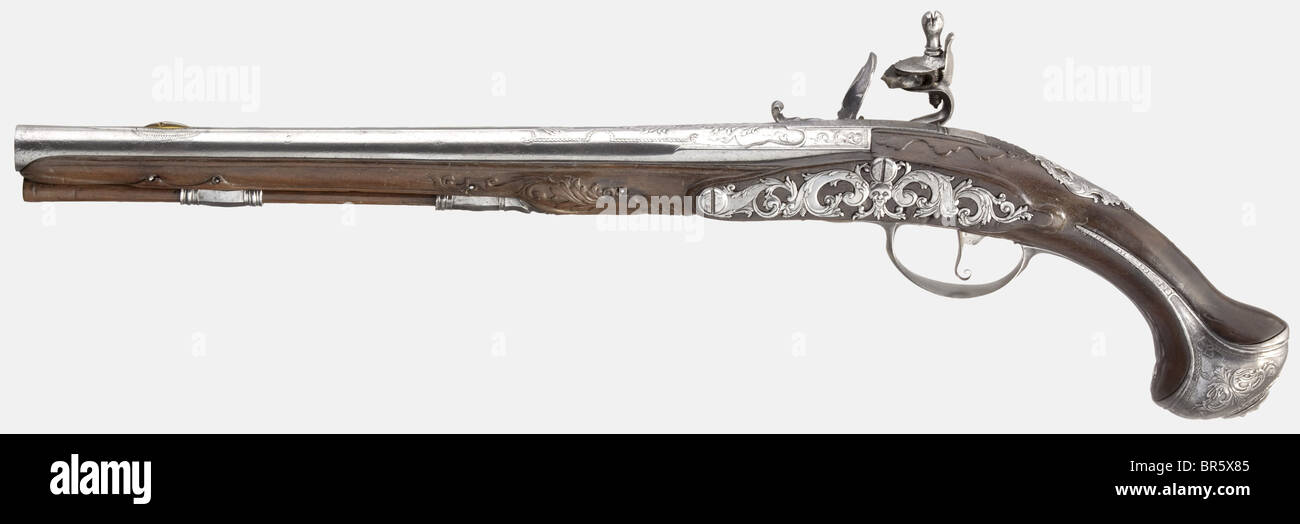 A fine pair of long flintlock pistols, France, circa 1710/20. Round ...