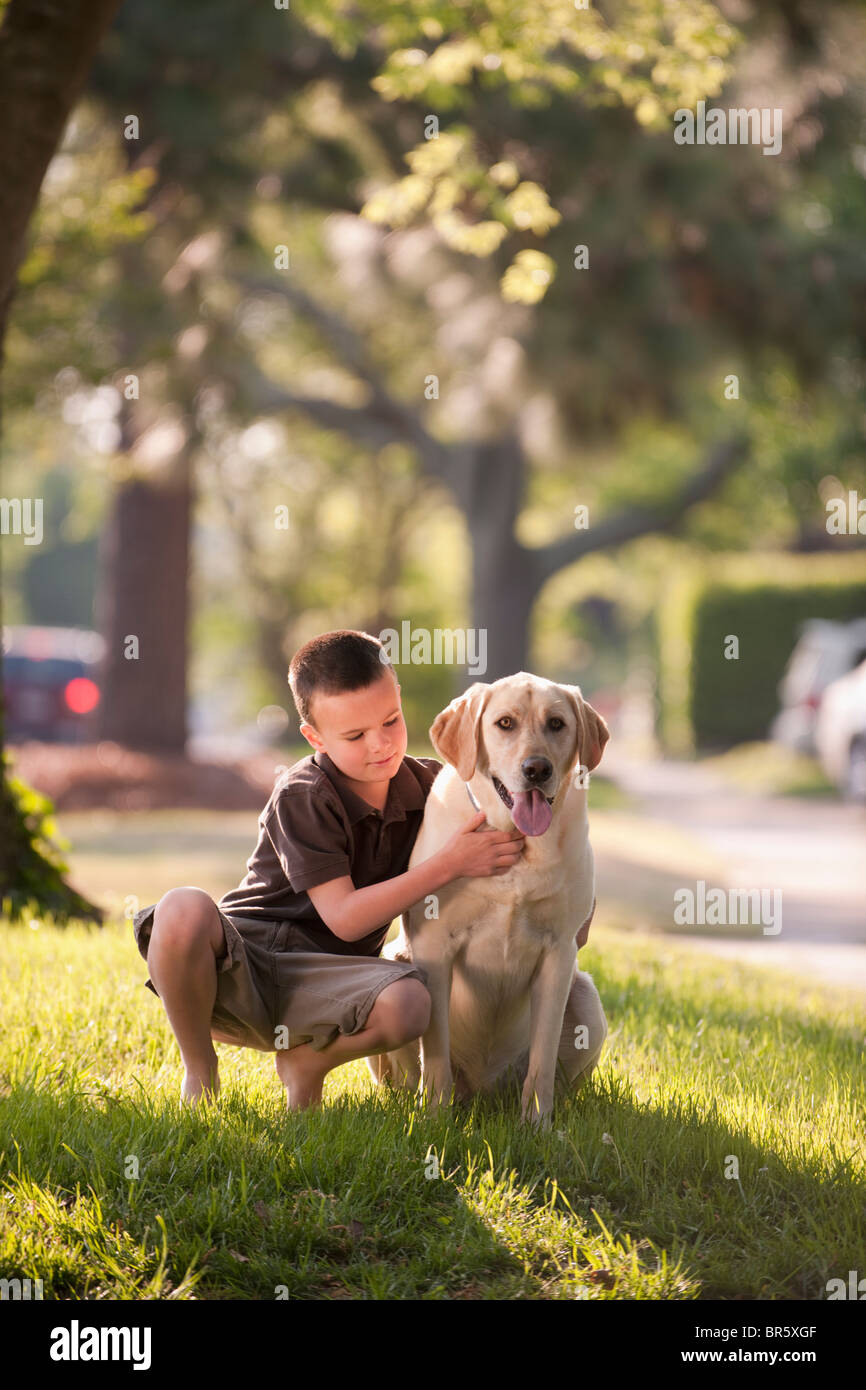 Boy petting his dog hi-res stock photography and images - Alamy