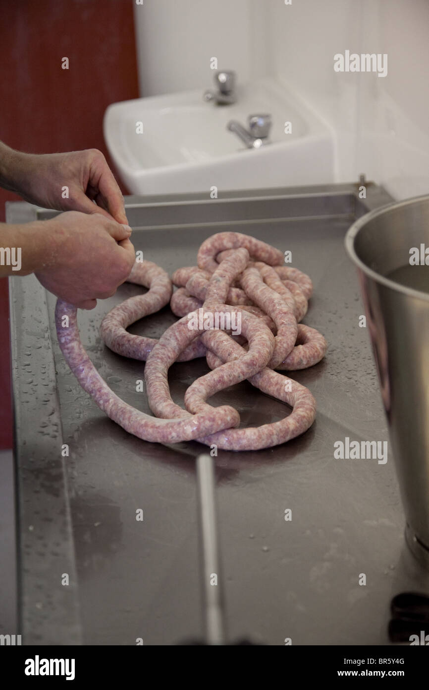 Pork sausages being made by hand Stock Photo - Alamy