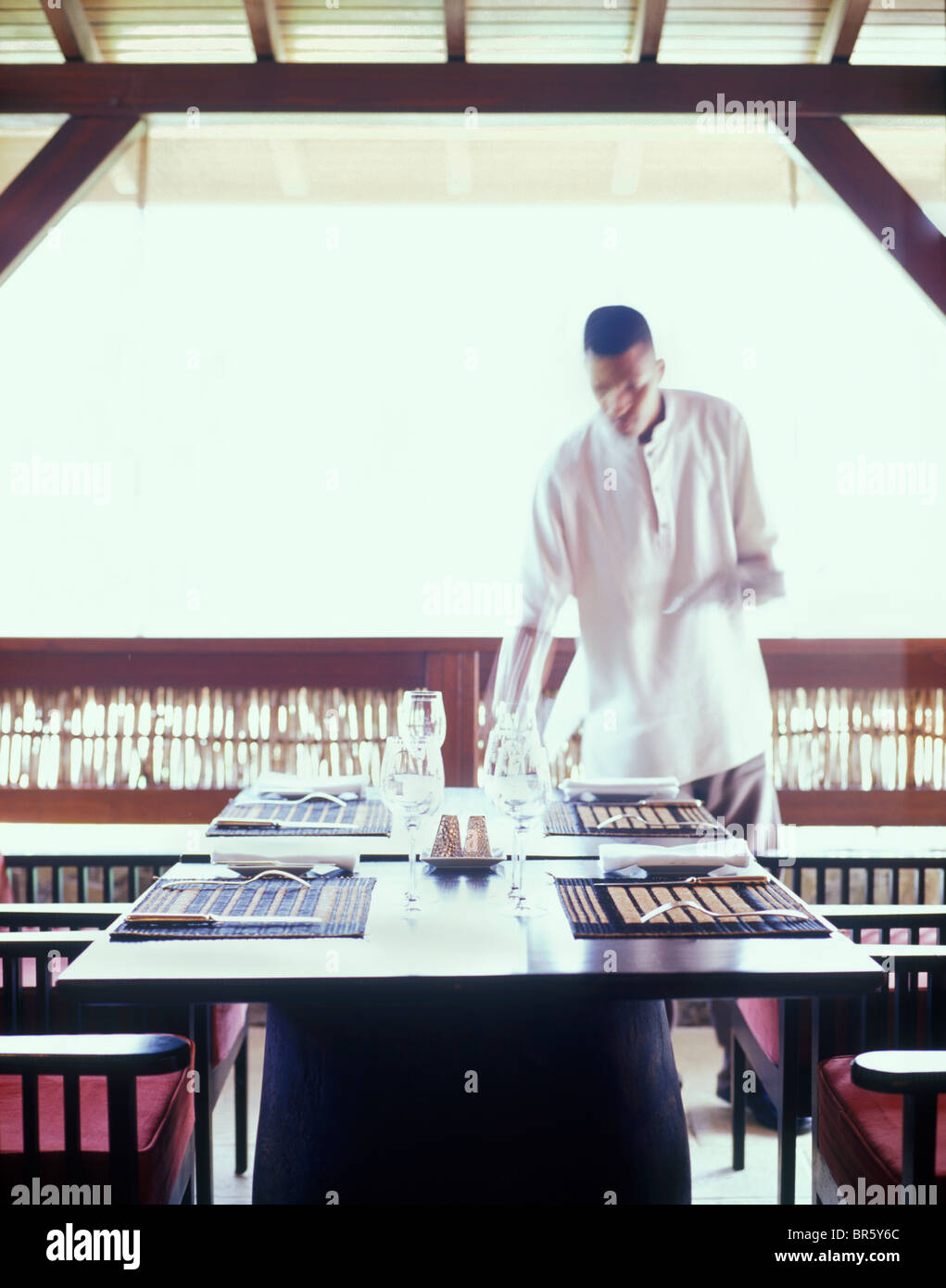 Waiter sets table hi-res stock photography and images - Alamy