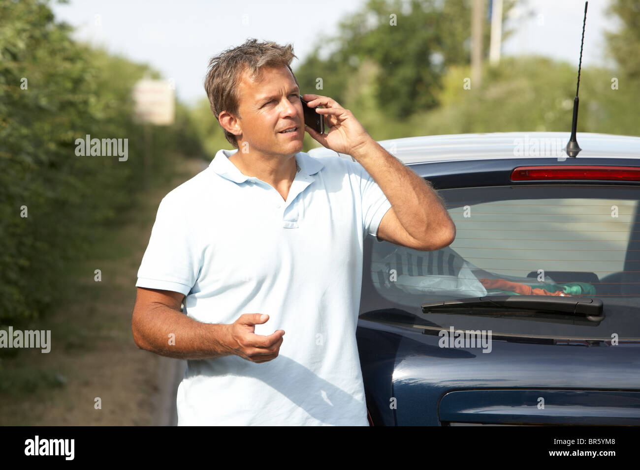 Driver Broken Down On Country Road Stock Photo - Alamy