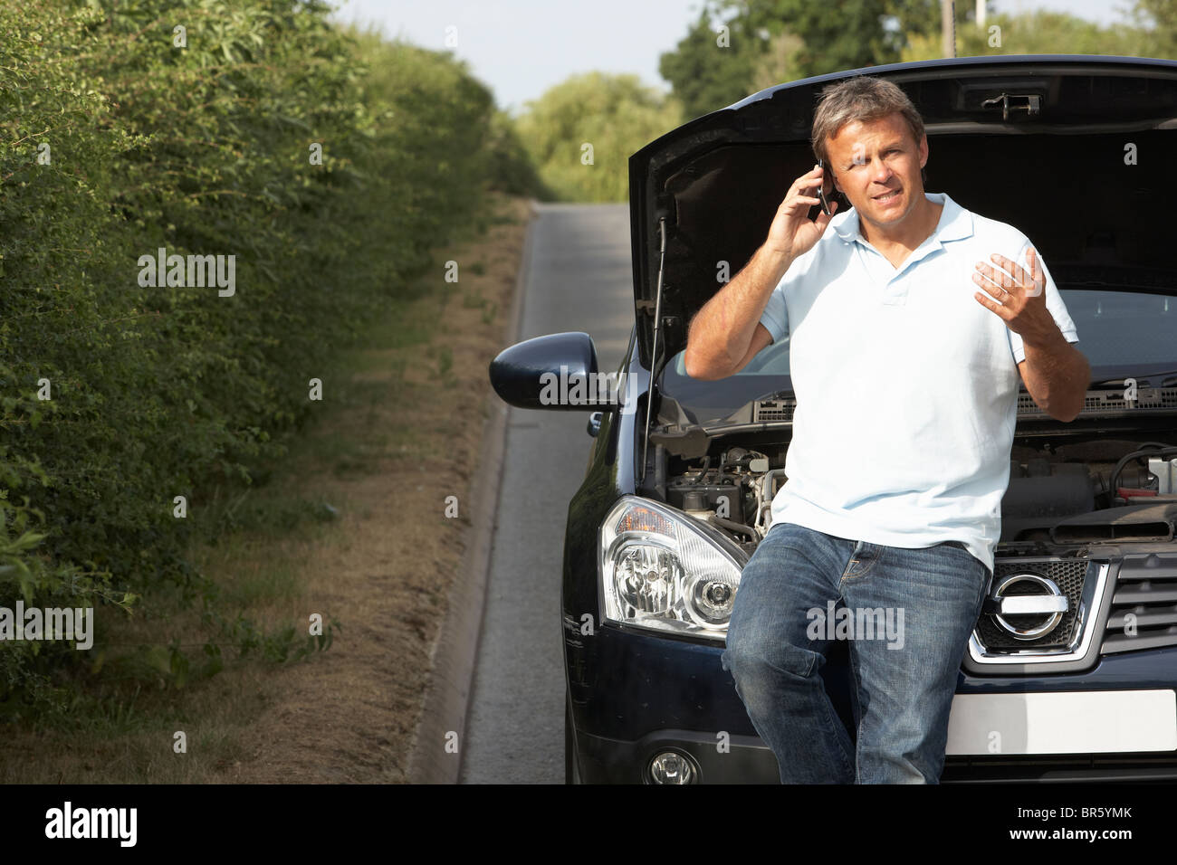 Driver Broken Down On Country Road Stock Photo - Alamy