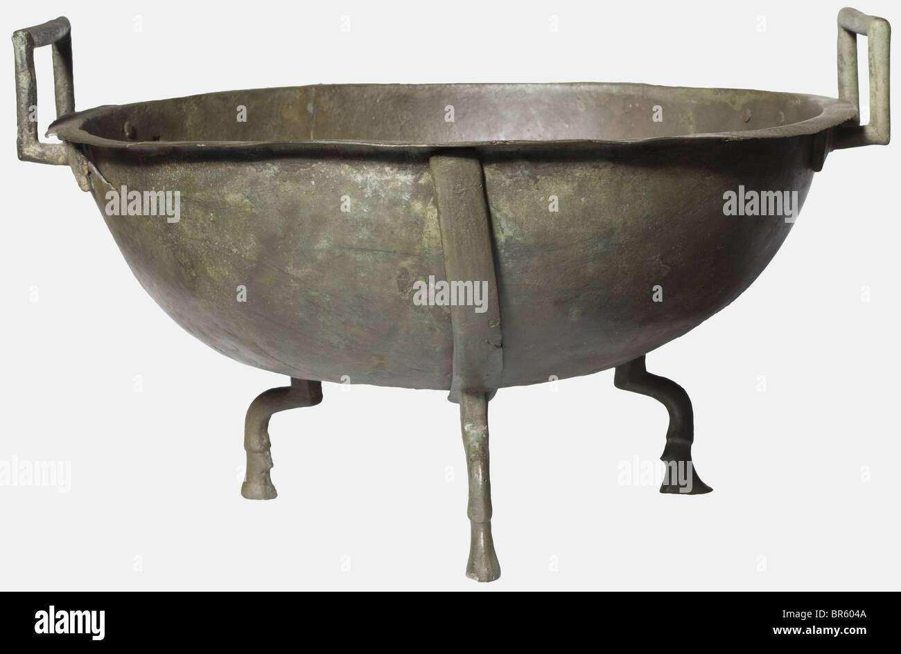 A large bronze Greek tripod bowl, 5th/4th century B.C. Cold work ...