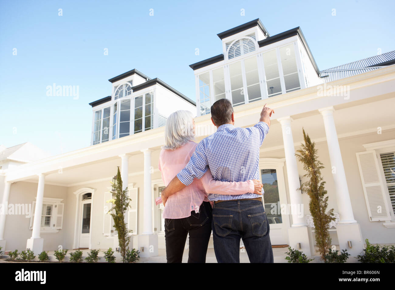 Couple standing outside house back hi-res stock photography and images ...