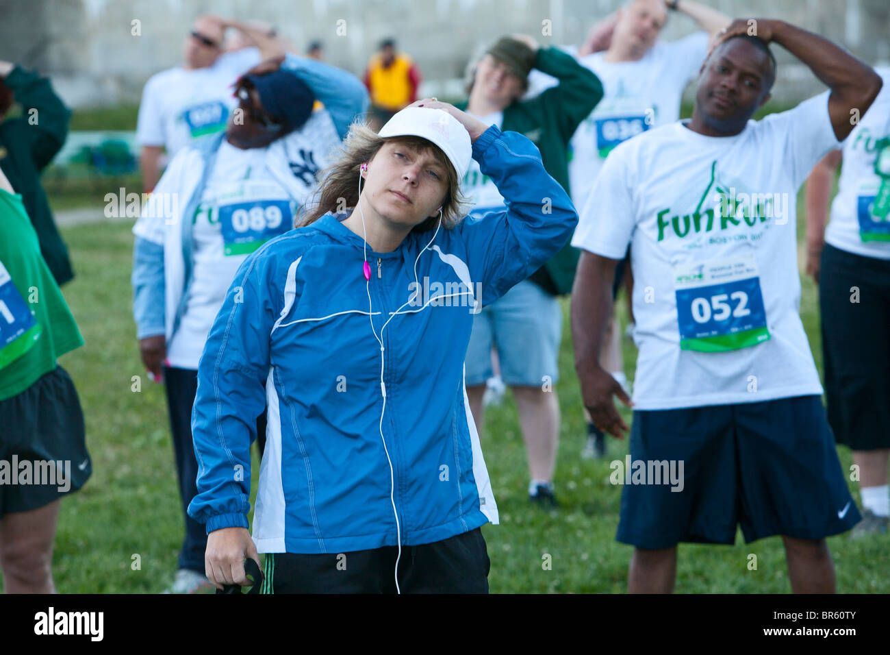Stretching Before Fun Run Stock Photo - Alamy