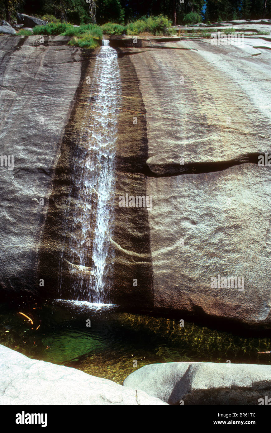 Spring water flows on granite cliff spring nature mountain sierra ...