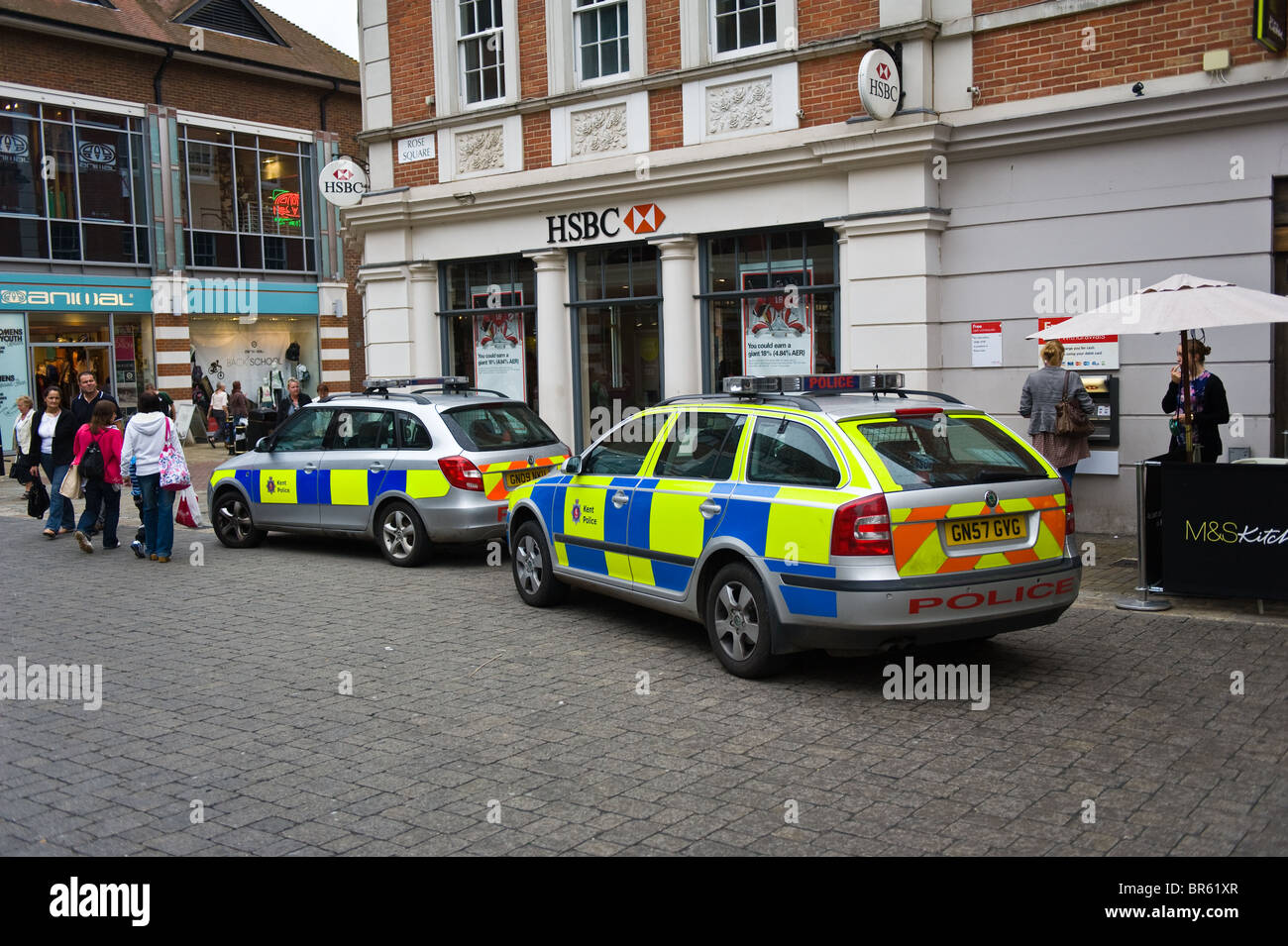 Two Police patrol cars attending an incident at HSBC in Canterbury ...